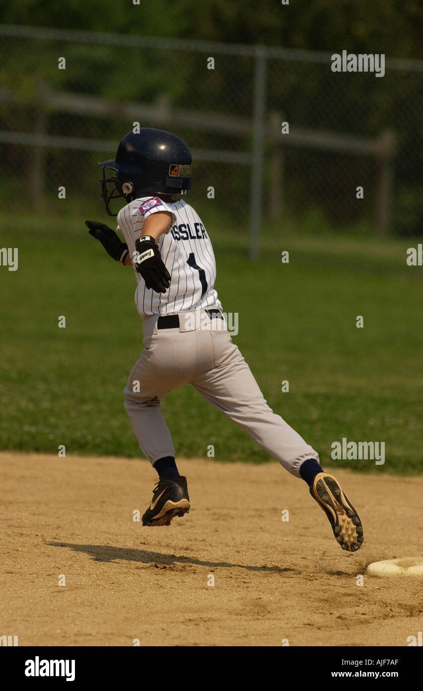 Youth baseball game action Stock Photo - Alamy