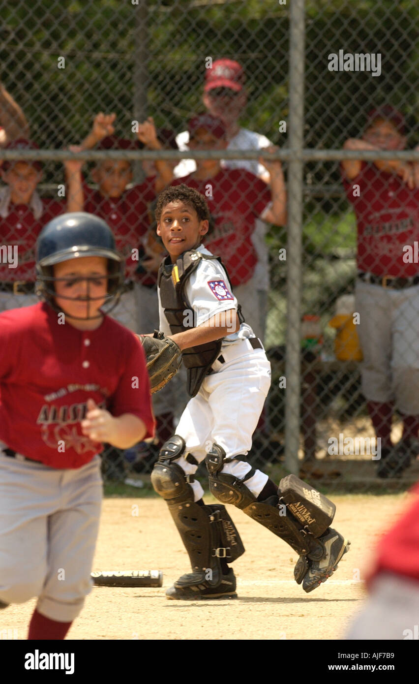 Youth baseball game action Stock Photo - Alamy