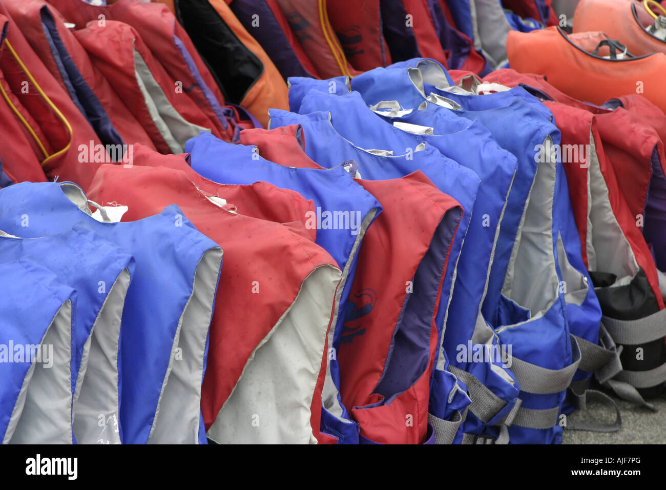 life jackets stacked in a row Stock Photo - Alamy
