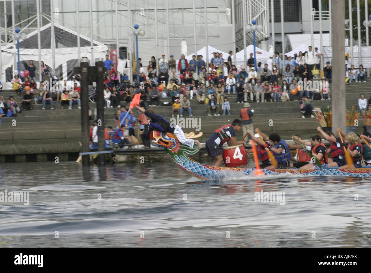 dragon boat team working together padding in unison Stock Photo - Alamy
