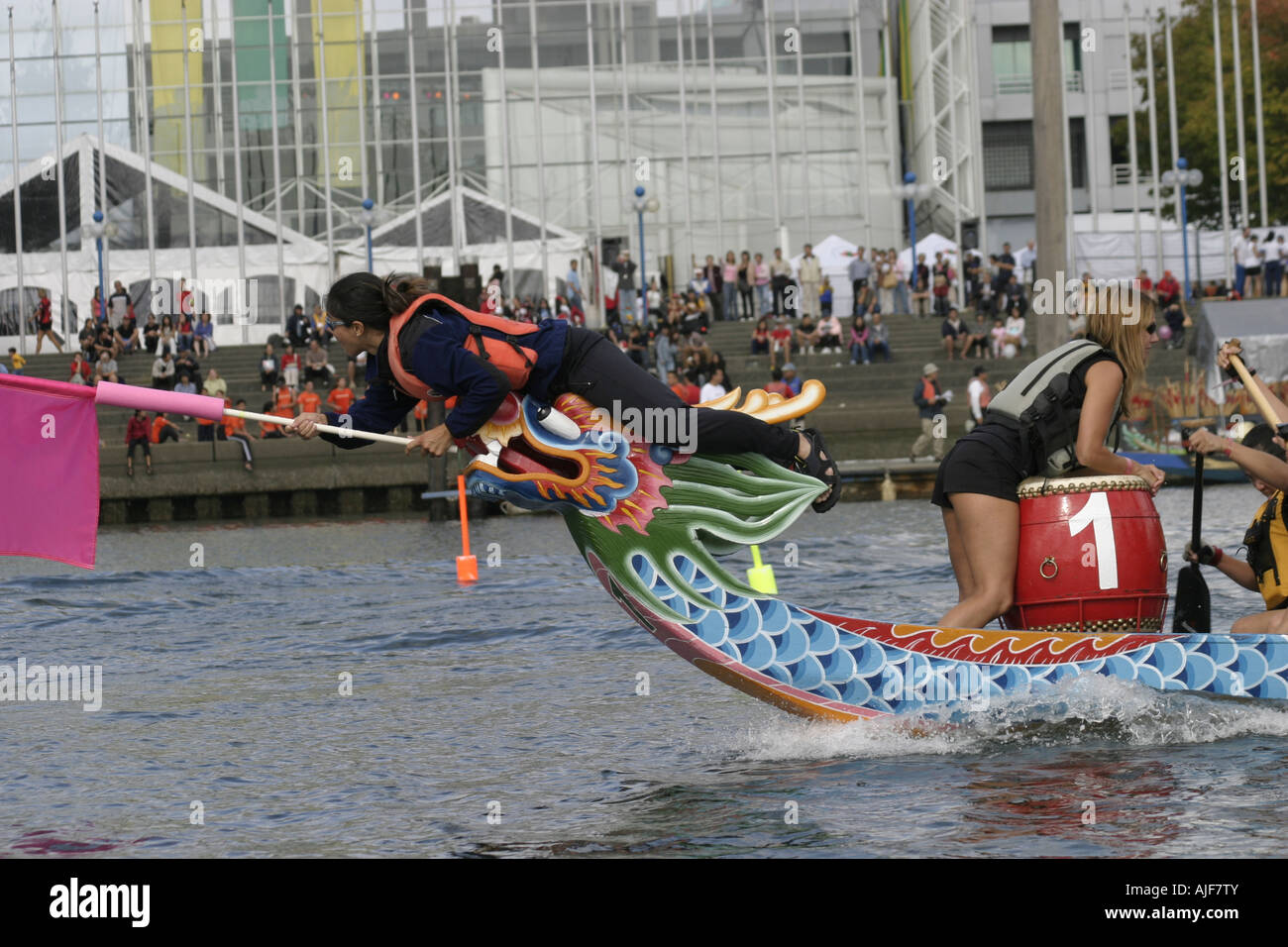 dragon boat team working together padding in unison Stock Photo - Alamy