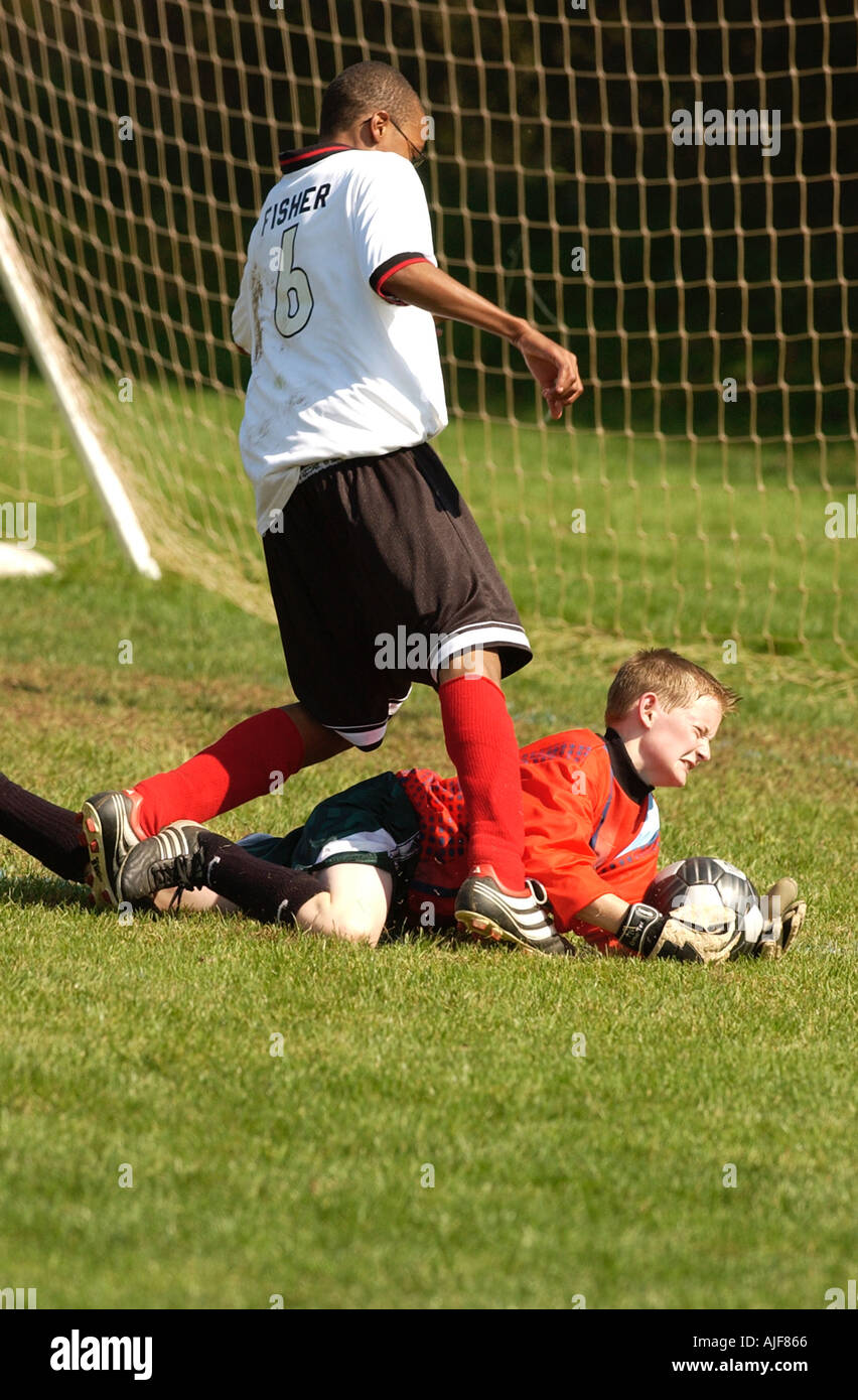 Youth boy s football action American soccer Stock Photo - Alamy