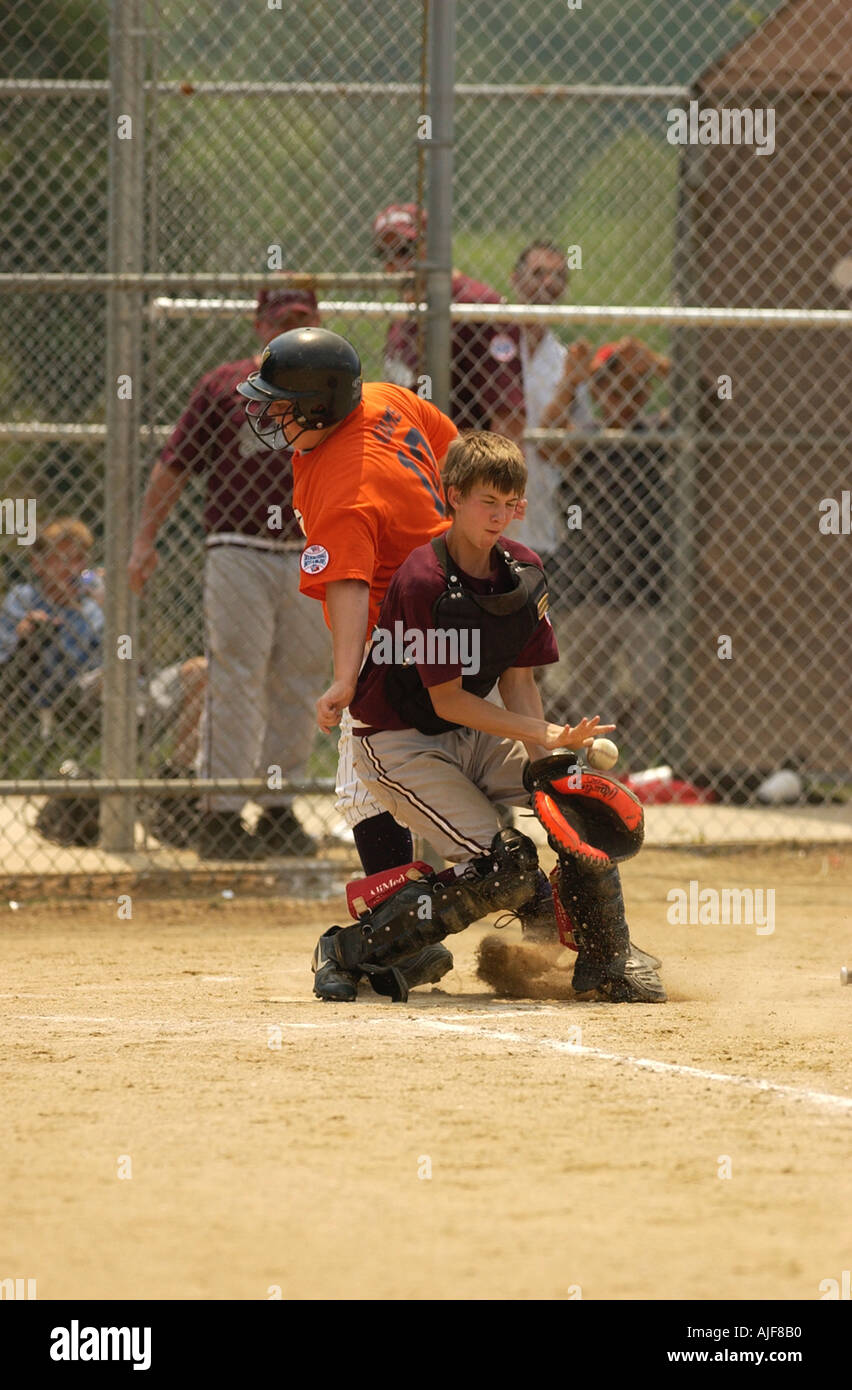 Youth baseball game action Stock Photo - Alamy