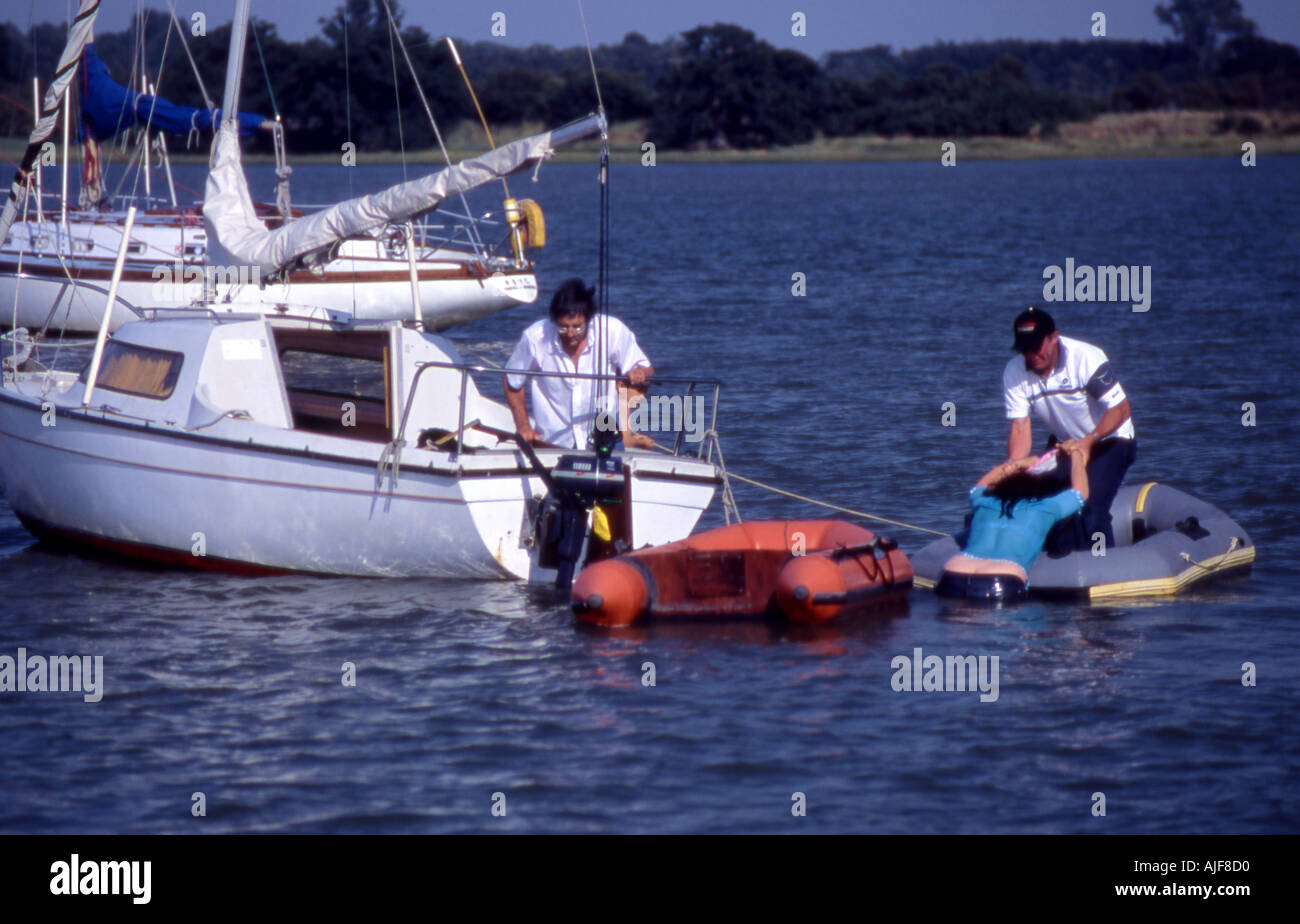 rescuing woman overboard from yacht Stock Photo - Alamy