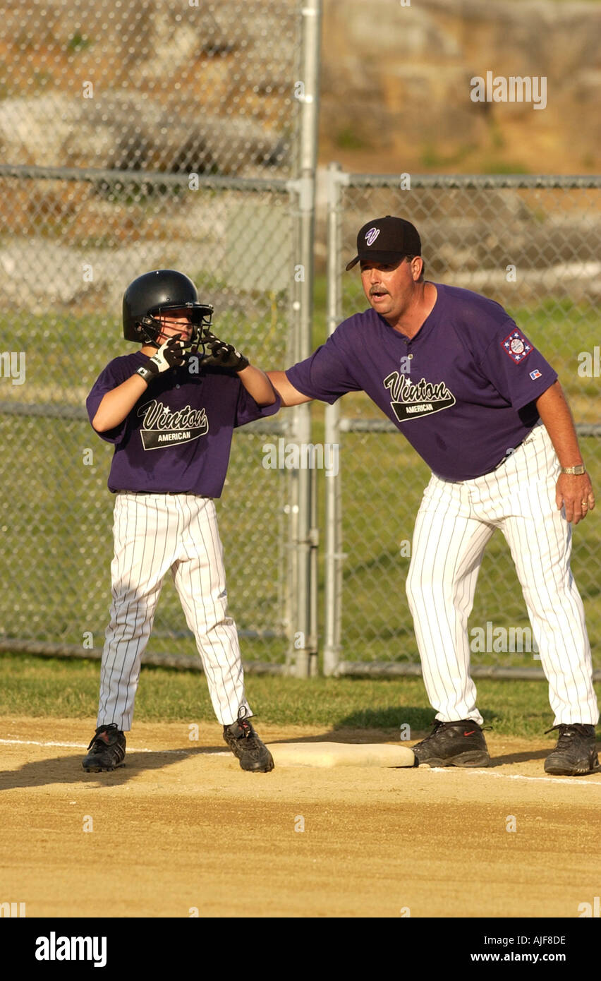 Youth baseball game action Stock Photo - Alamy