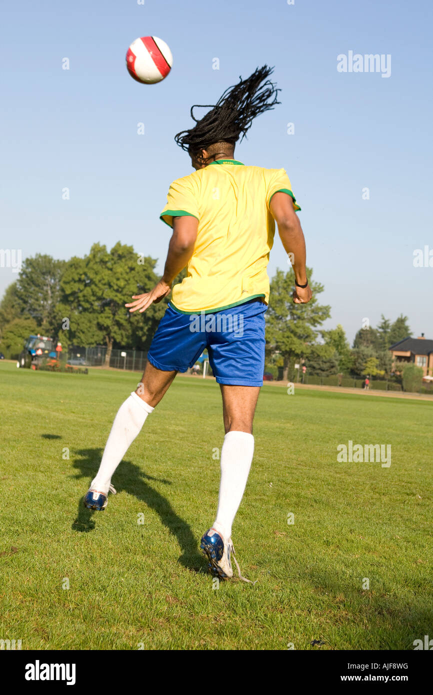 a black African American man playing soccer Stock Photo - Alamy