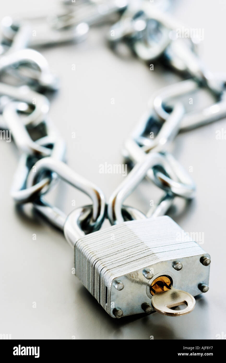 Padlock with key and chain Stock Photo - Alamy