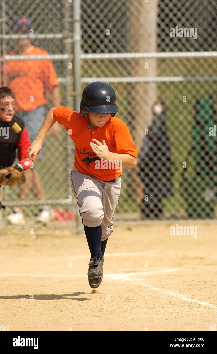 Youth baseball action Stock Photo - Alamy