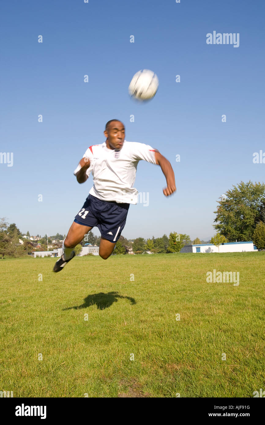 a black African American man playing soccer Stock Photo - Alamy