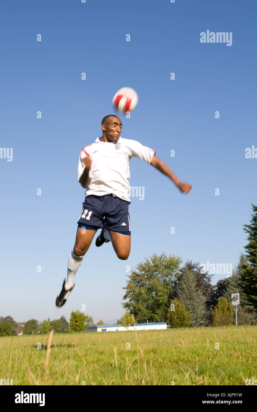 a black African American man playing soccer Stock Photo - Alamy