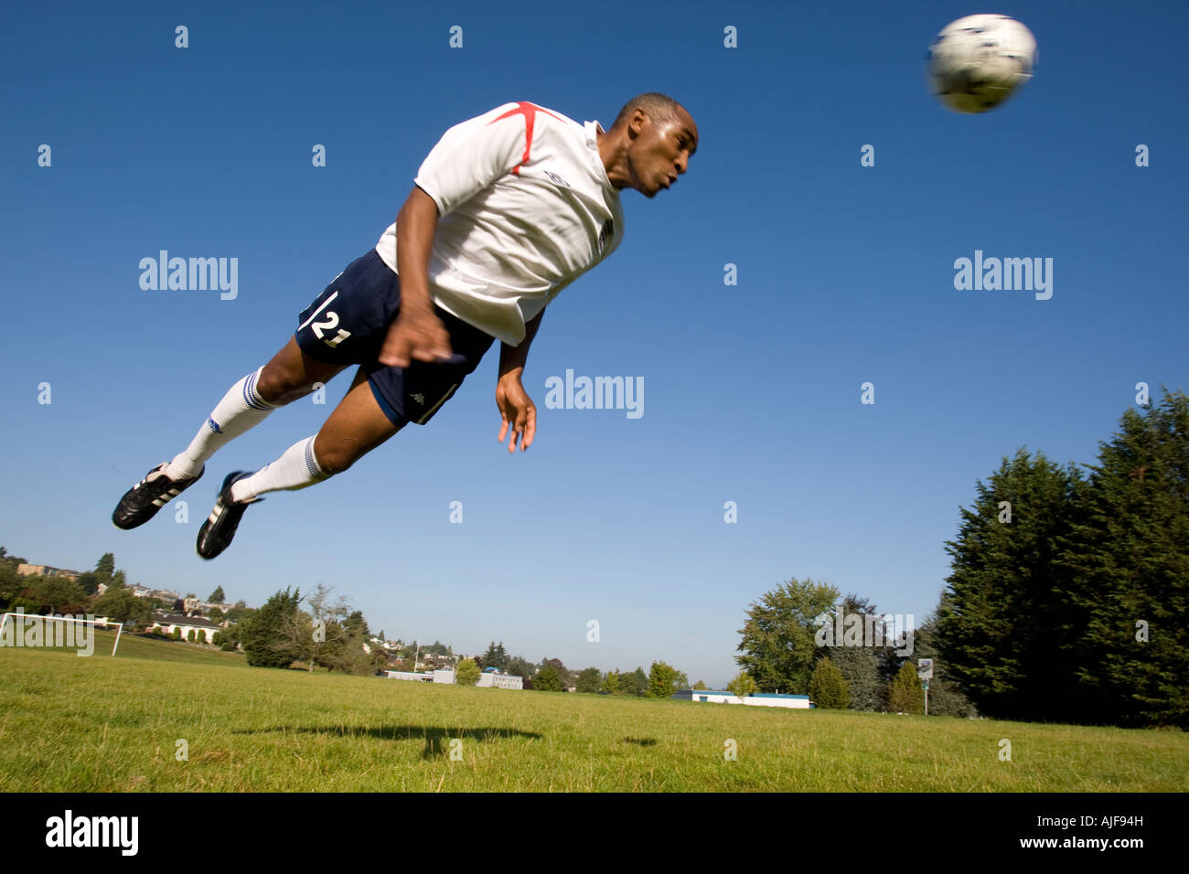 pa black African American man playing soccer Stock Photo - Alamy