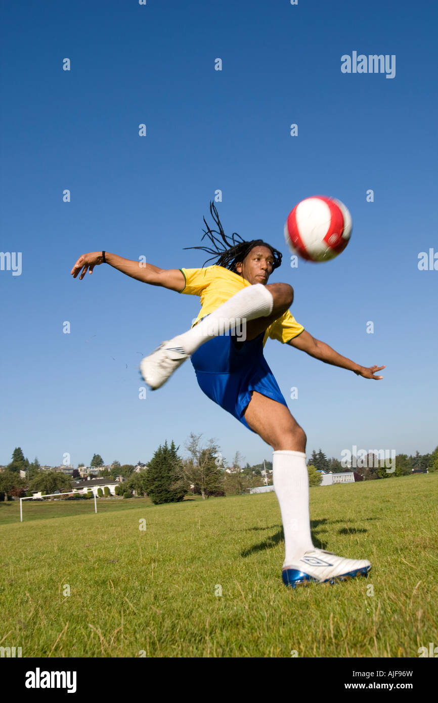 a black African American man playing soccer Stock Photo - Alamy