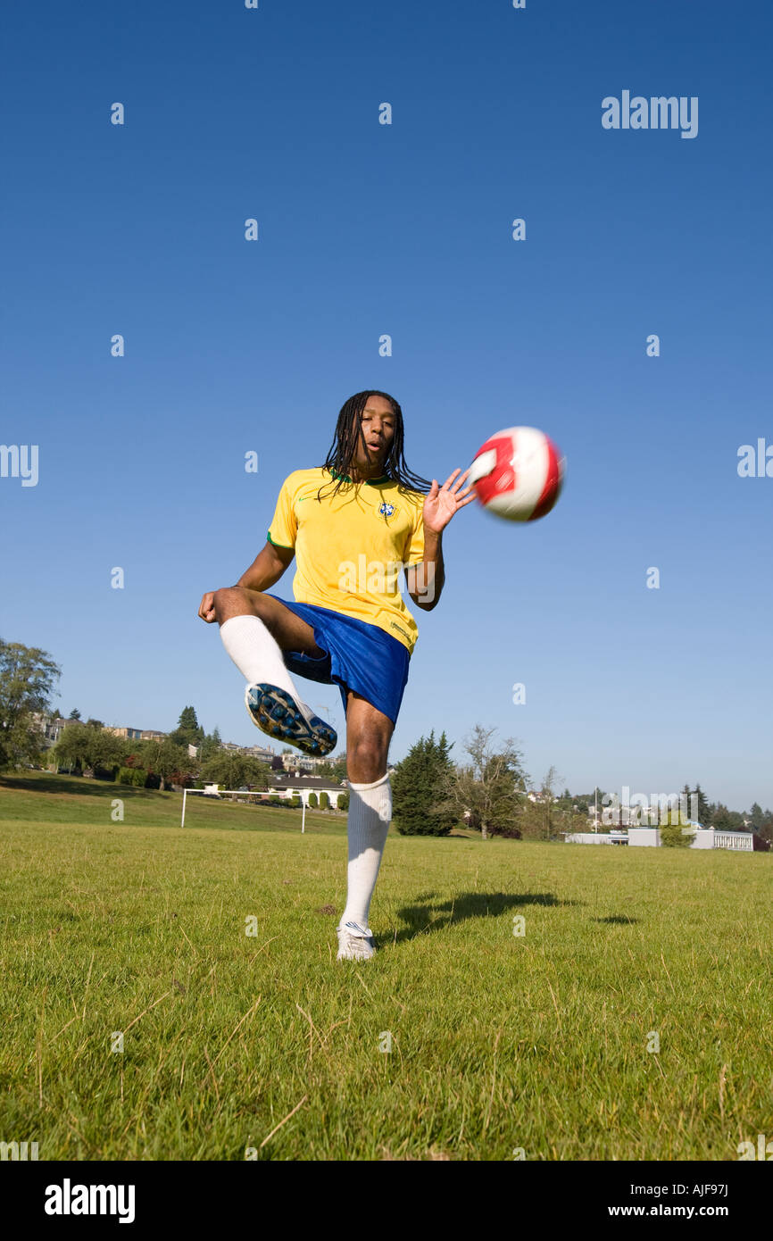 a black African American man playing soccer Stock Photo - Alamy