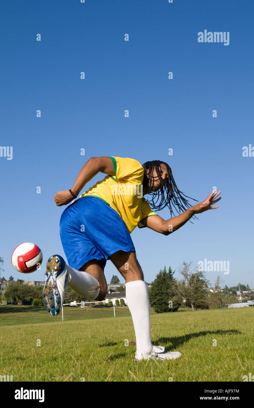 a black African American man playing soccer Stock Photo - Alamy