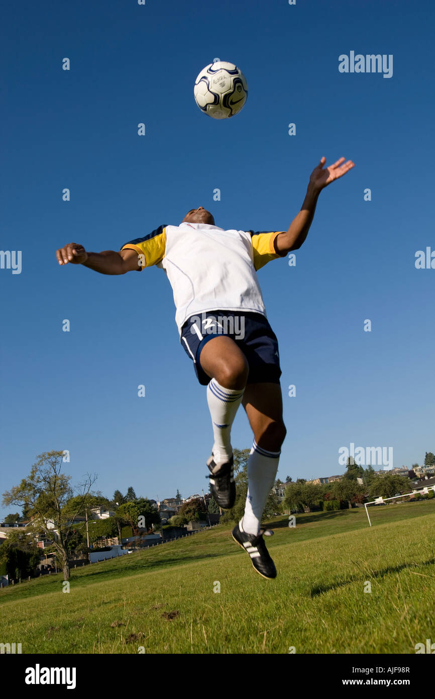 a black African American man playing soccer Stock Photo - Alamy