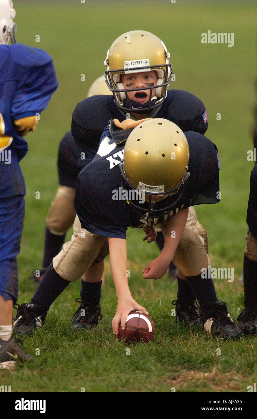 Youth biddy American football action Stock Photo - Alamy