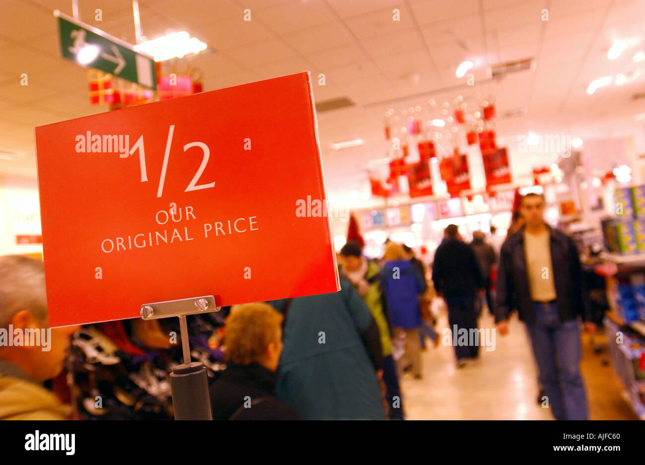 Sales posters in a department store in England UK Stock Photo - Alamy