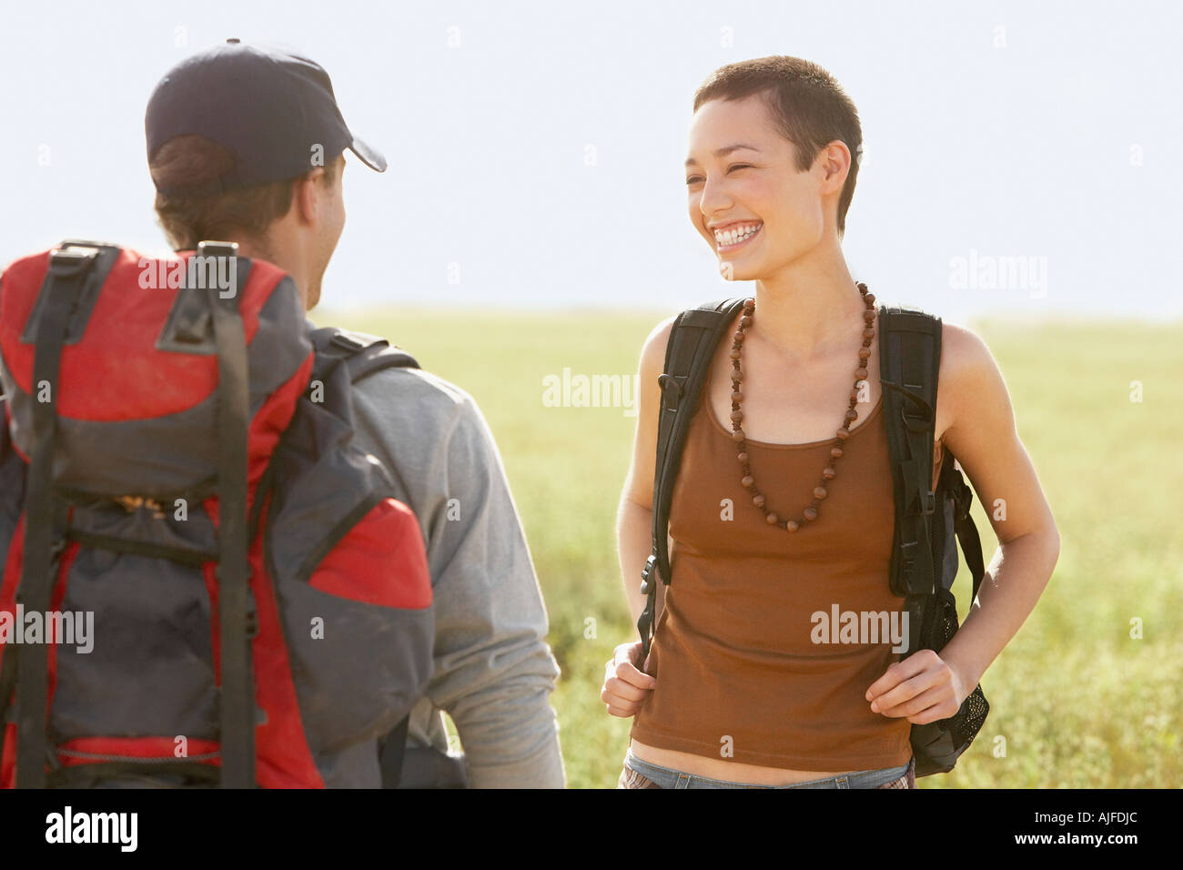 Woman in baseball cap talking hi-res stock photography and images - Alamy