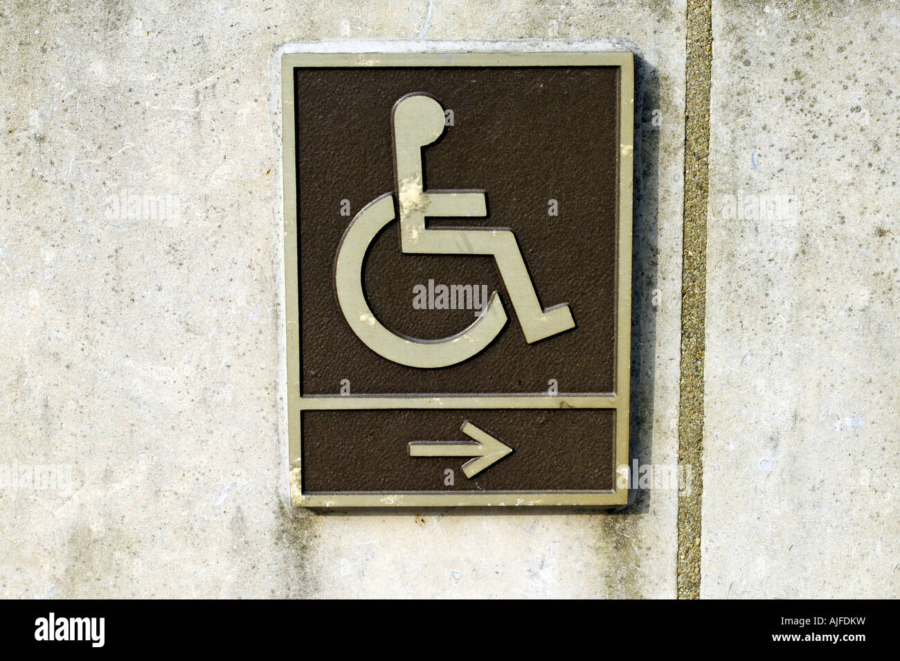Handicapped direction sign Stock Photo - Alamy