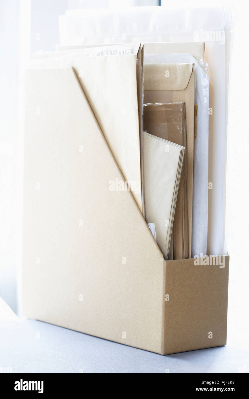 Box file filled with papers and envelopes Stock Photo - Alamy