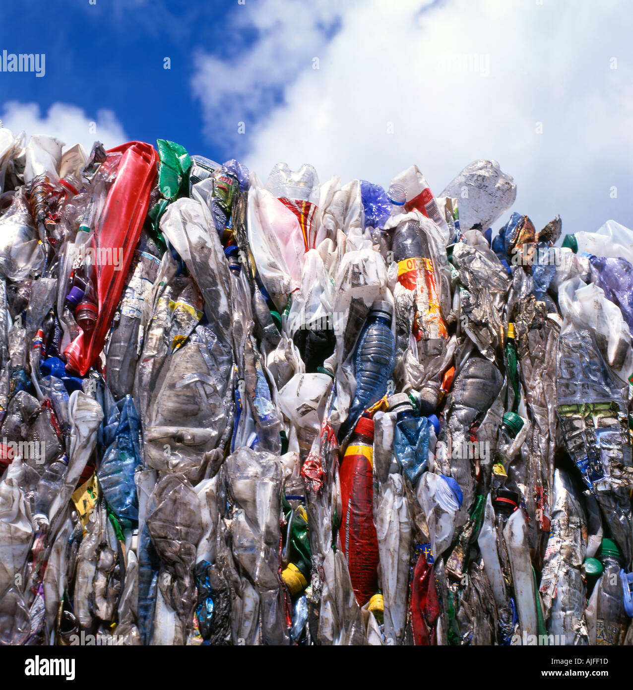 A compressed stack of plastic bottles and bags at a waste management ...