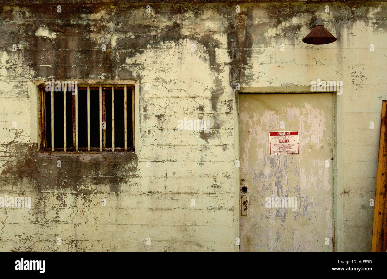 Old run down jail with waring sign on door Stock Photo - Alamy