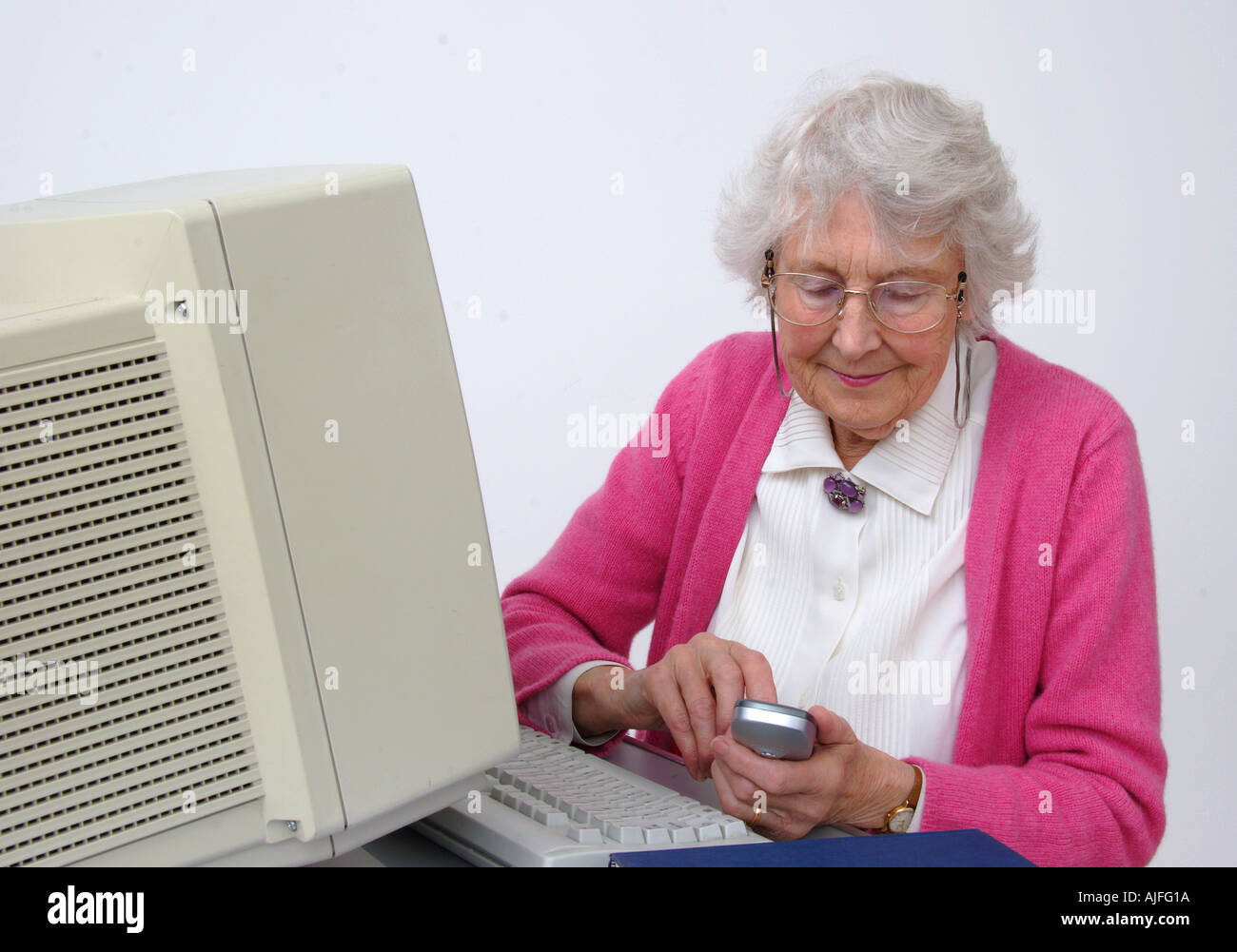 Elderly Lady at Computer Using Mobile Phone People Lifestyle Wales ...