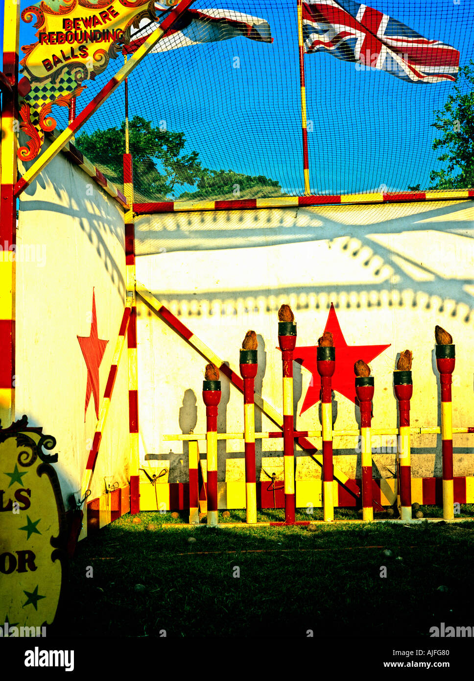 Knock of the coconut stand in traditional fairgriund Stock Photo - Alamy