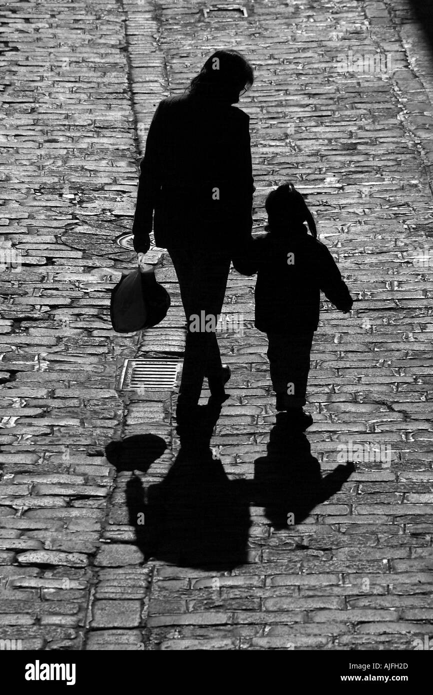 Mother and children silhouette shadow Black and White Stock Photos ...