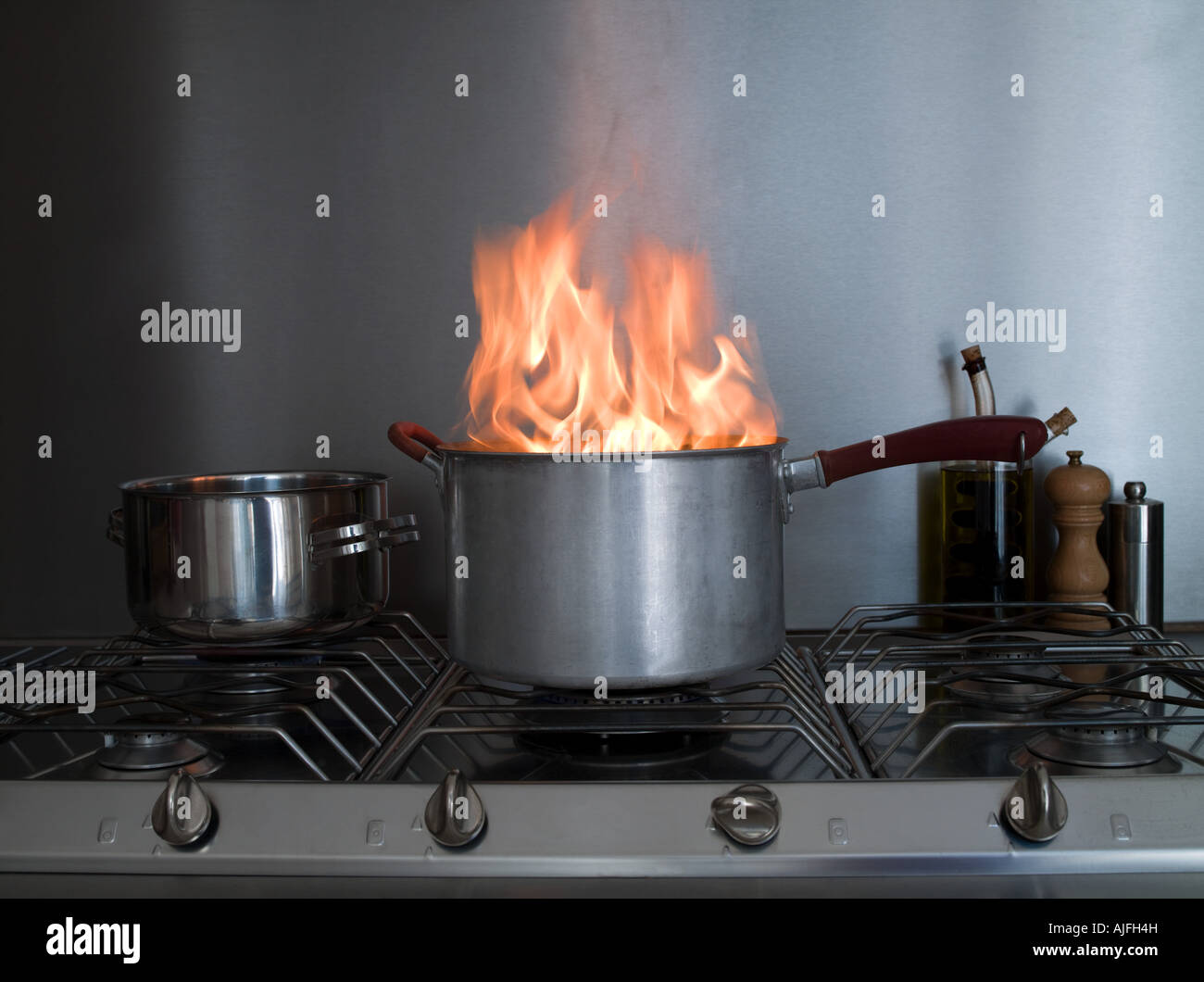 A saucepan on fire Stock Photo - Alamy