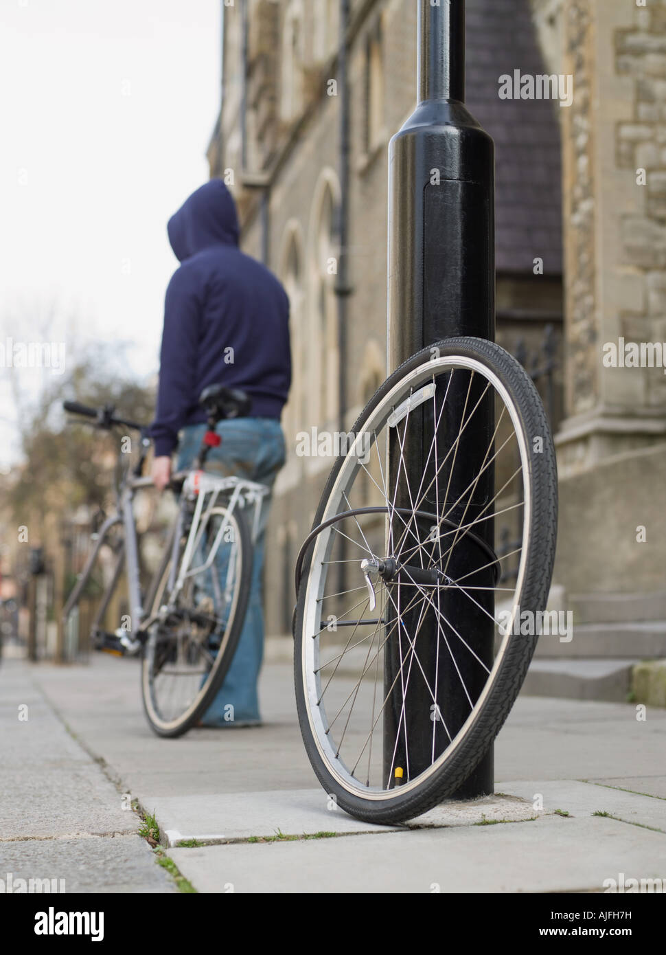 A thief stealing a bike Stock Photo - Alamy