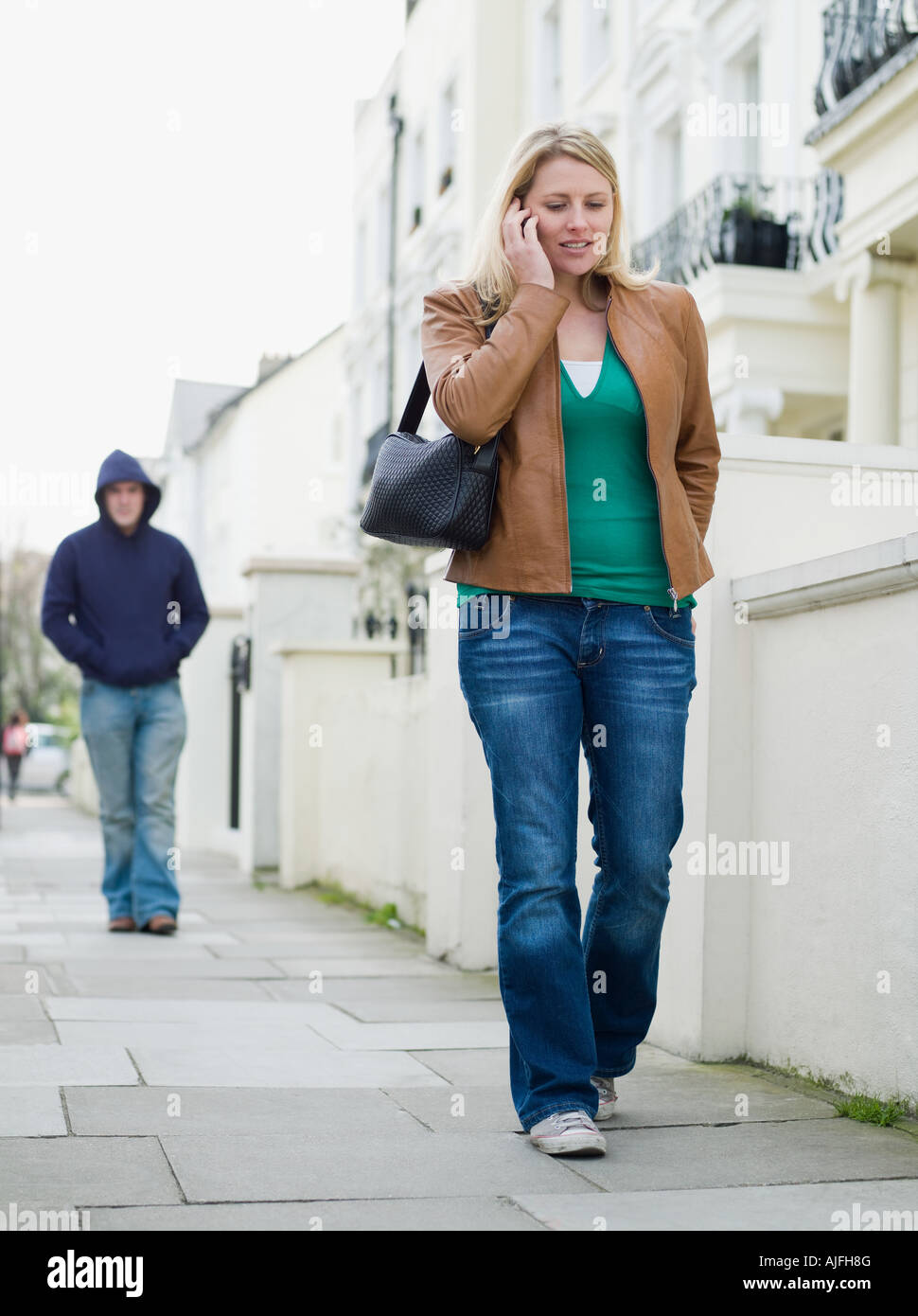 A woman being stalked Stock Photo - Alamy