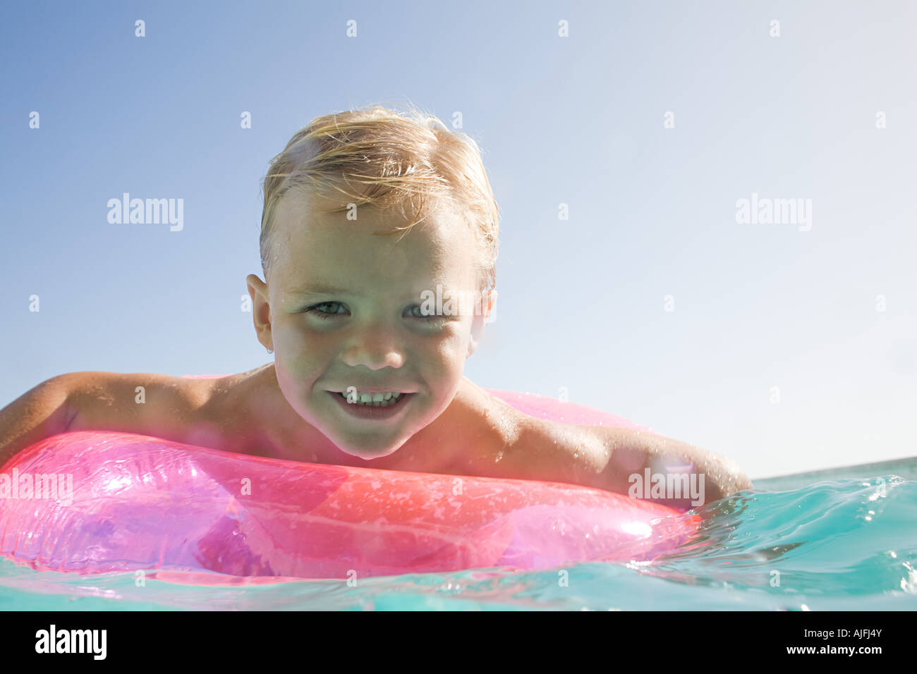 Youngster Floating In Pool High Resolution Stock Photography and Images ...