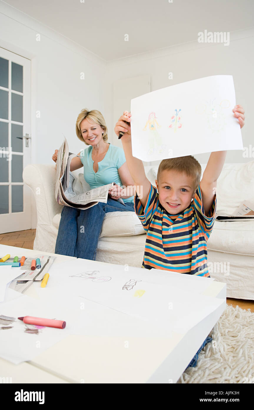 Boy holding a drawing Stock Photo - Alamy
