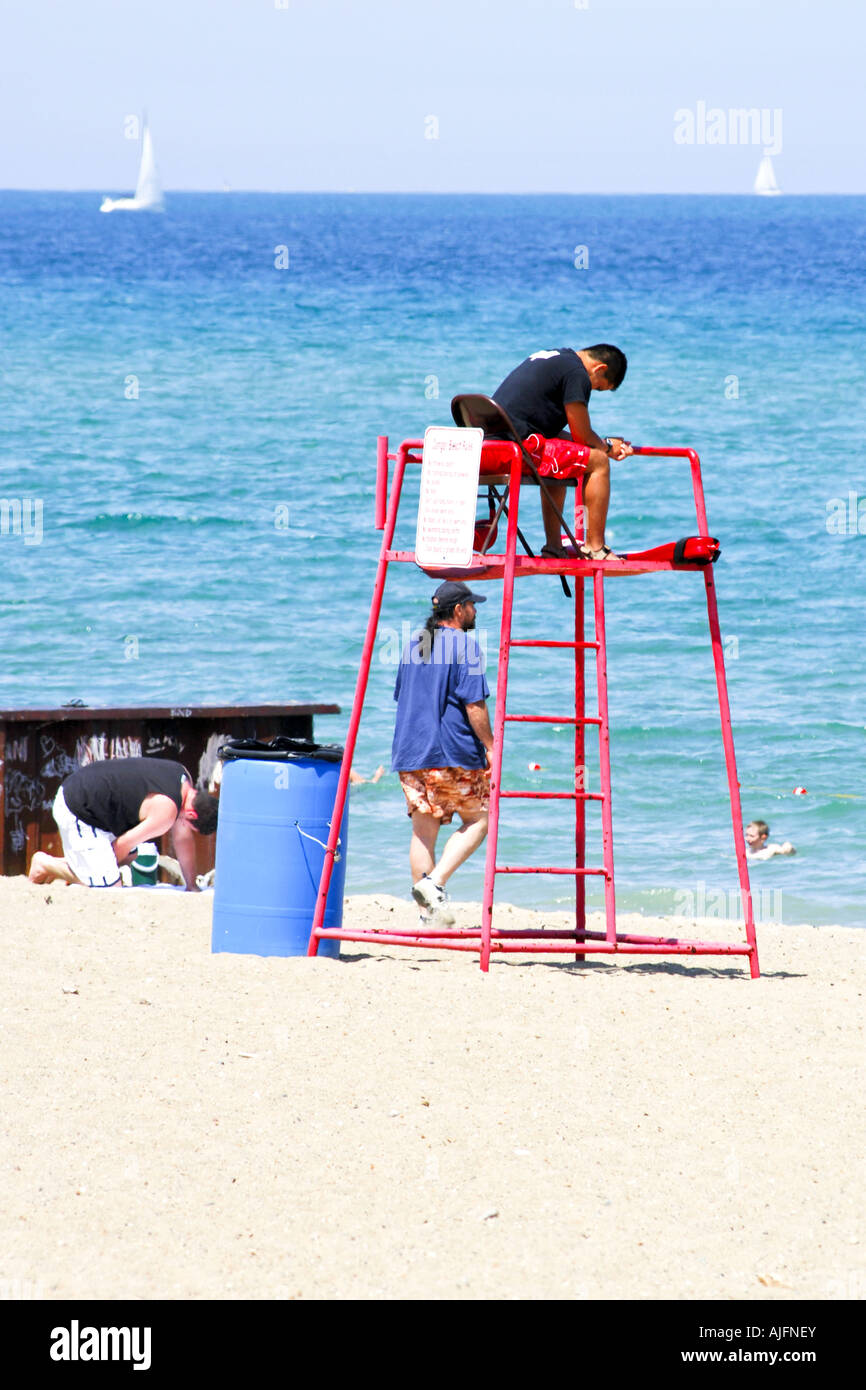 Lifeguard in his watchtower at the beach Stock Photo - Alamy