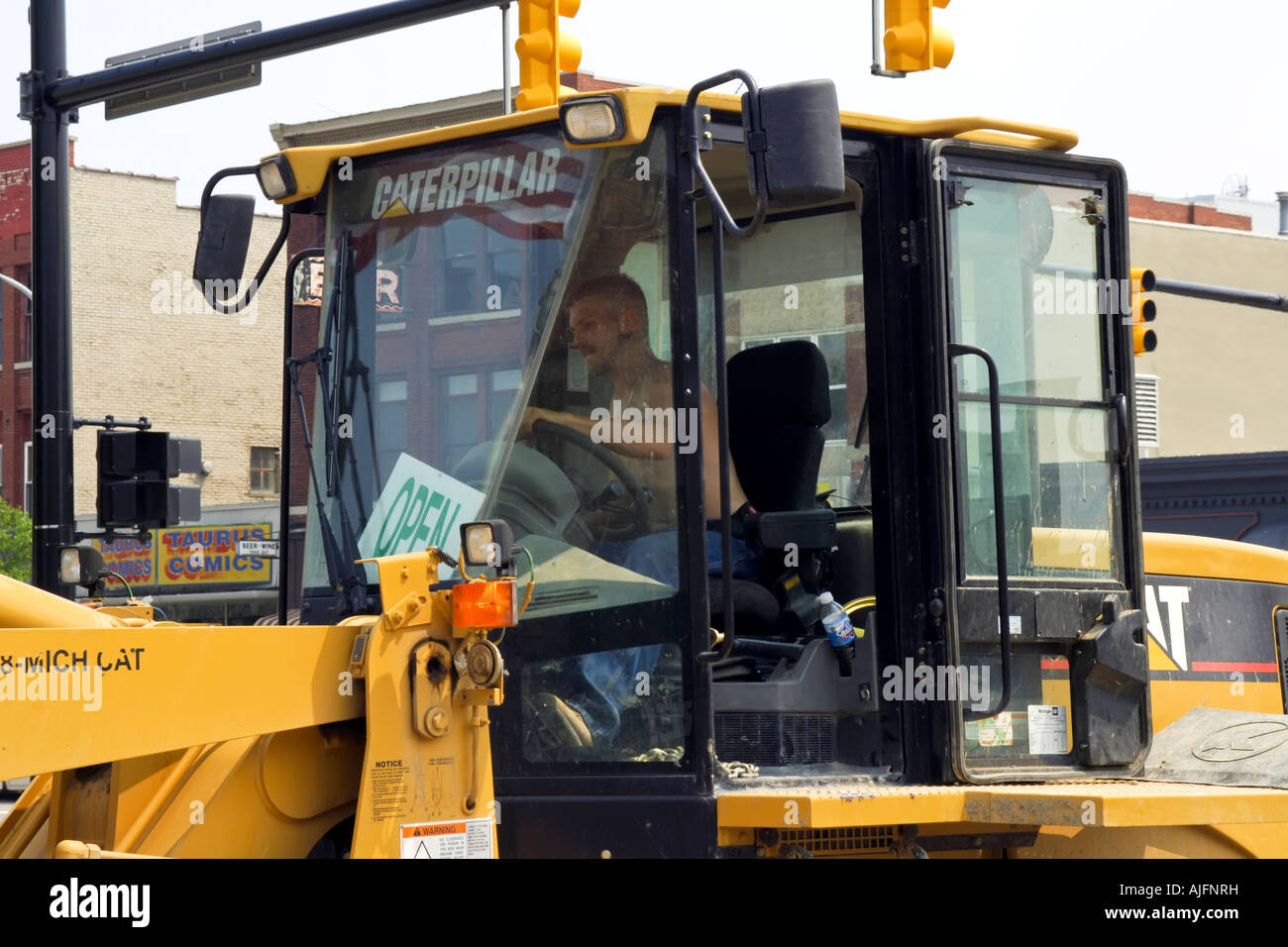 Close up of an earth mover operator in his cab Stock Photo - Alamy