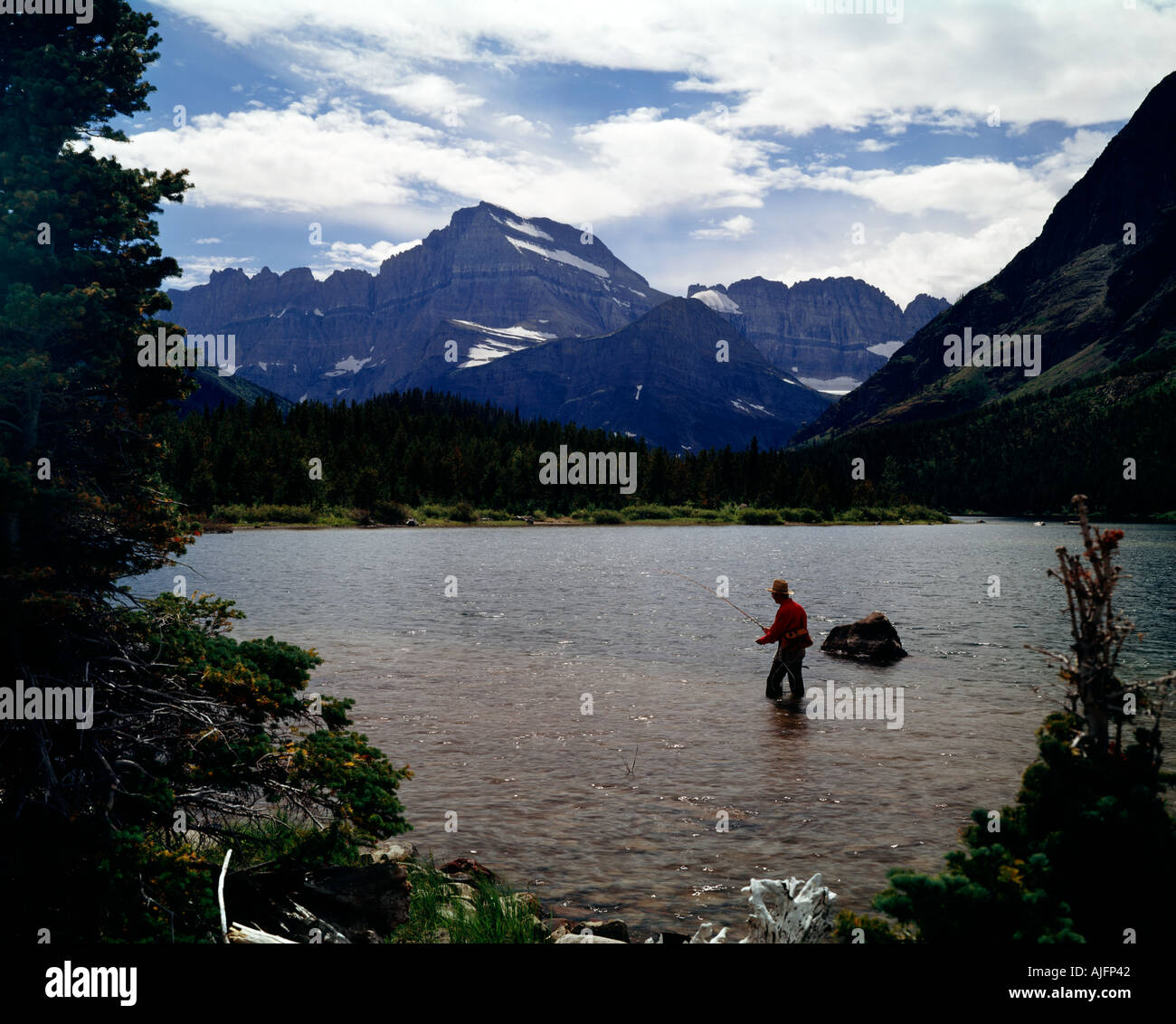 Glacier National Park in Montana showing fishing on Swiftcurrent Lake ...