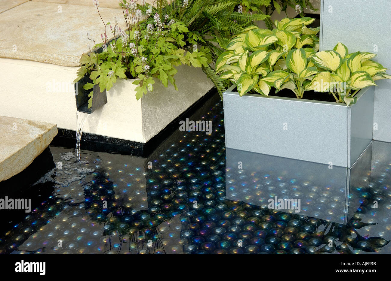 Water feature and limestone paving Stock Photo - Alamy
