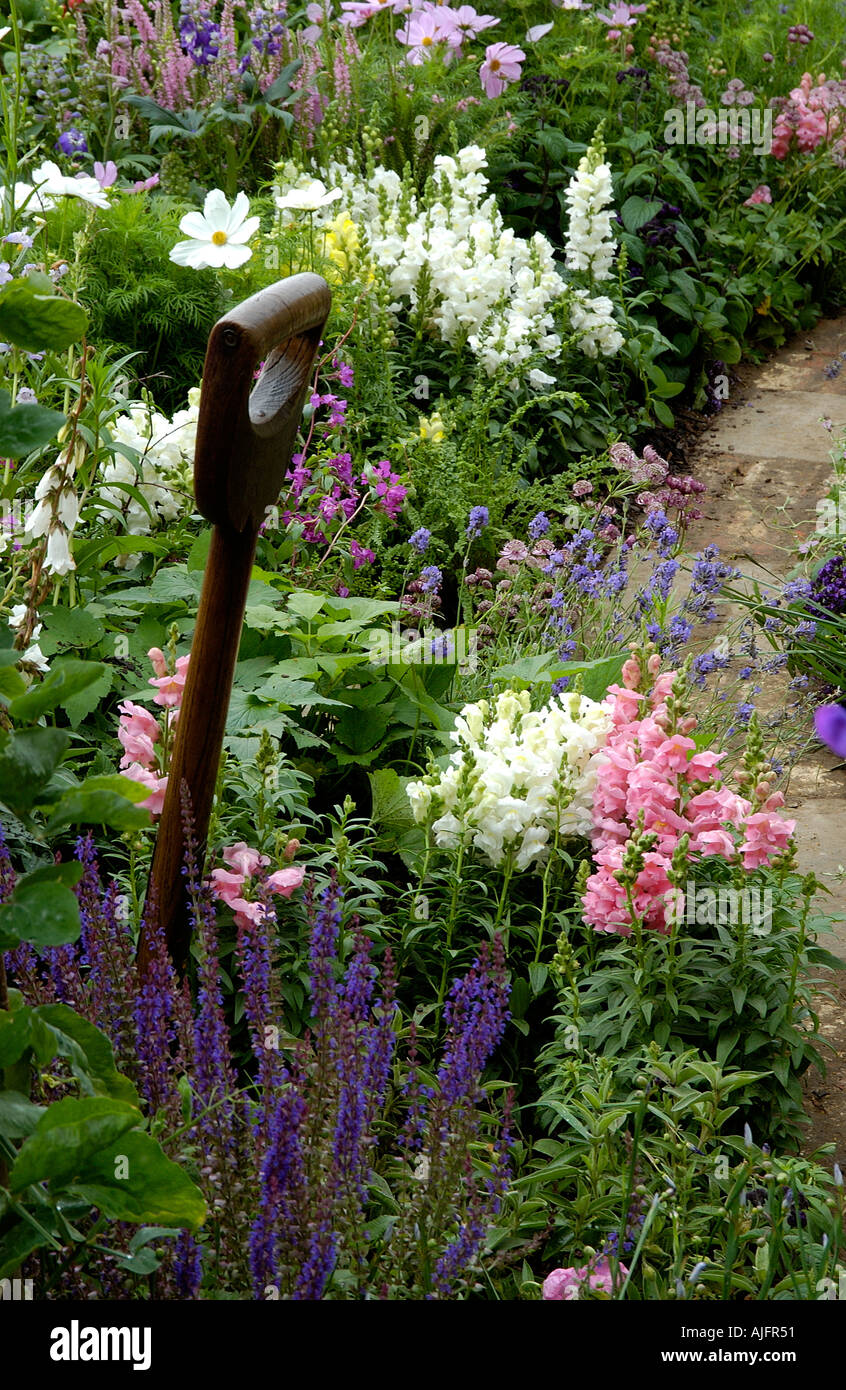 Garden folk in a Cottage Garden Stock Photo - Alamy