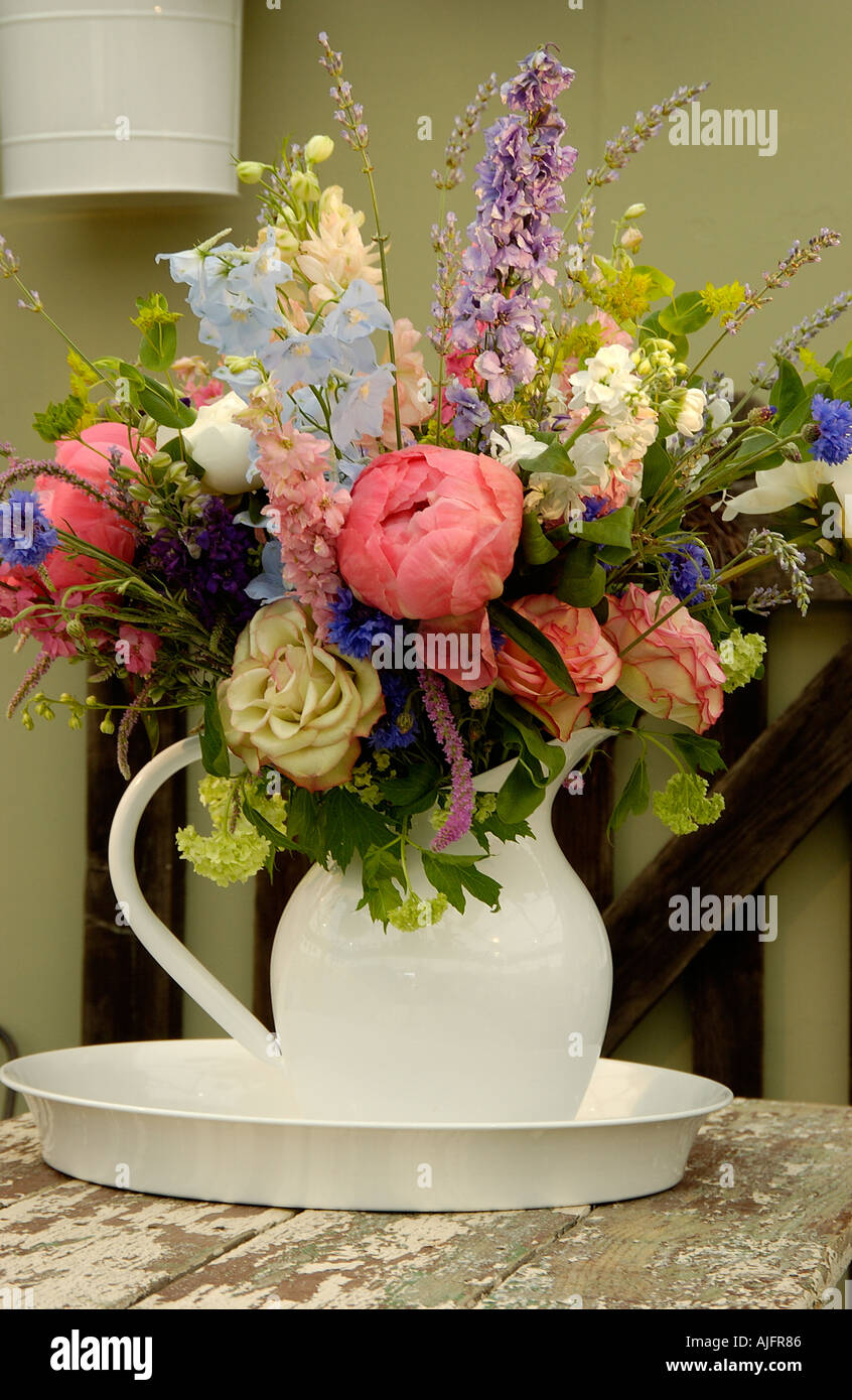 Summer flower arrangement in a white ceramic jug Stock Photo - Alamy