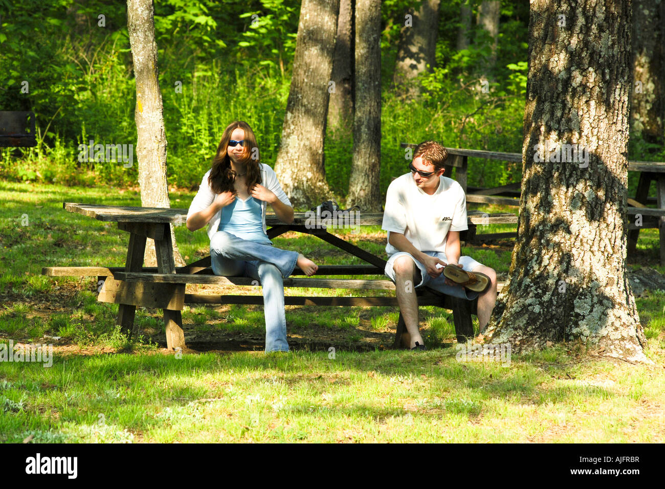 People Sitting Apart On A Bench