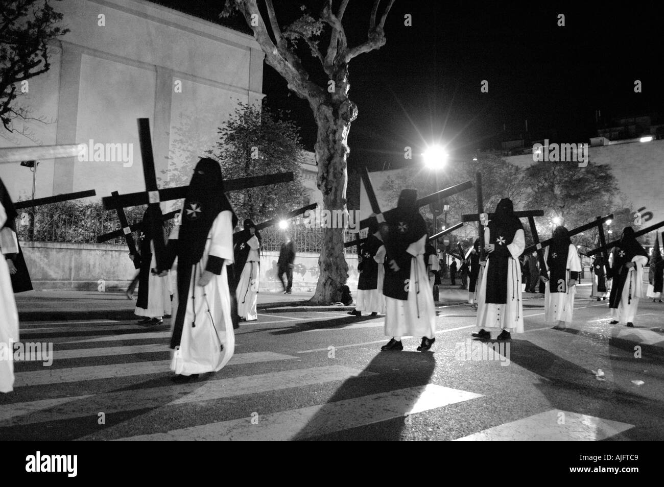 Rows of penitents during Holy Week processions Seville Spain Stock ...