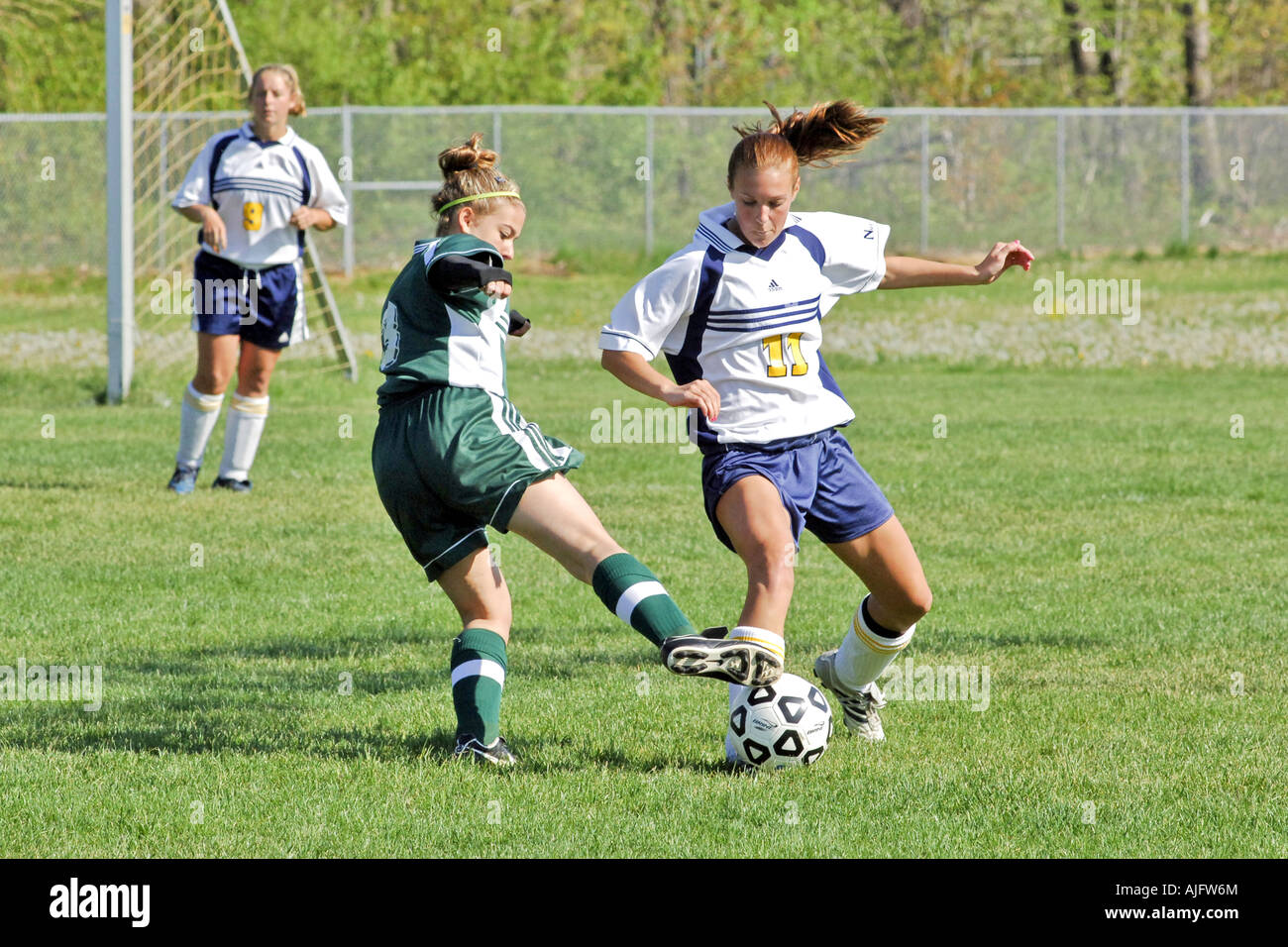Teenage girls involved in High School Soccer action Stock Photo - Alamy