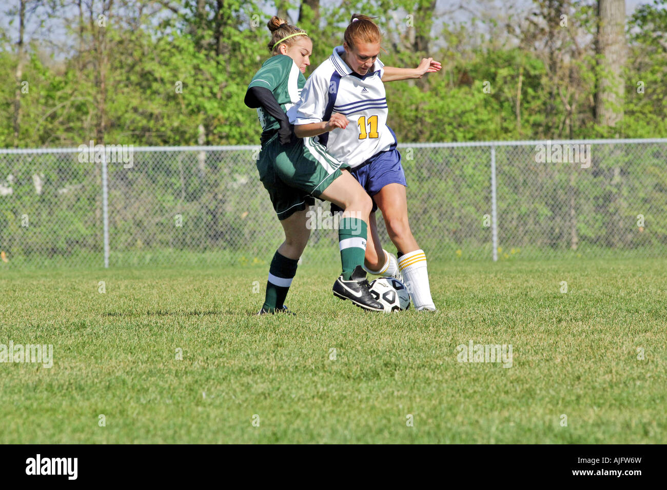 Teenage girls involved in High School Soccer action Stock Photo - Alamy