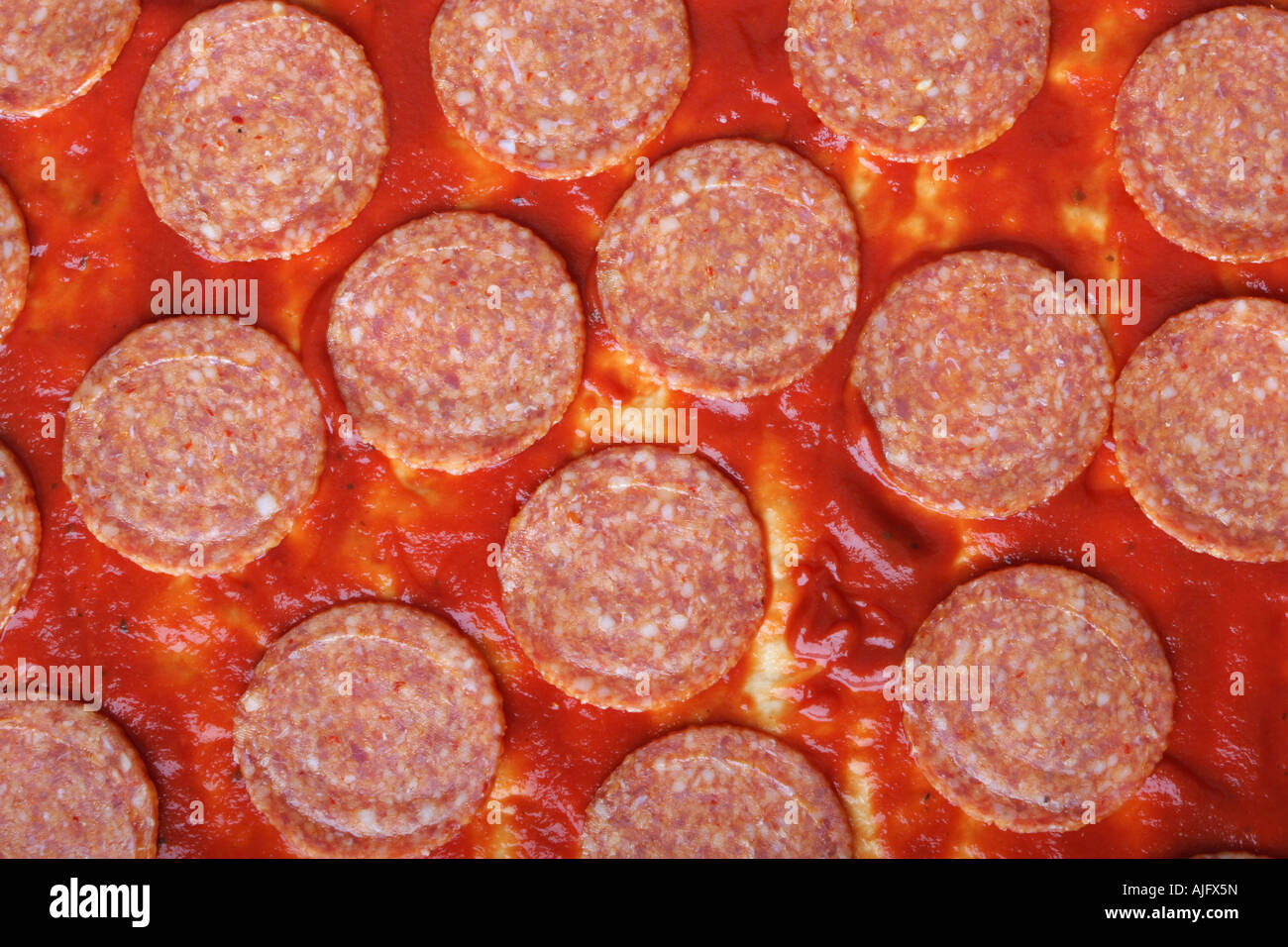 pepperoni on a pizza cropped shot great background Stock Photo - Alamy