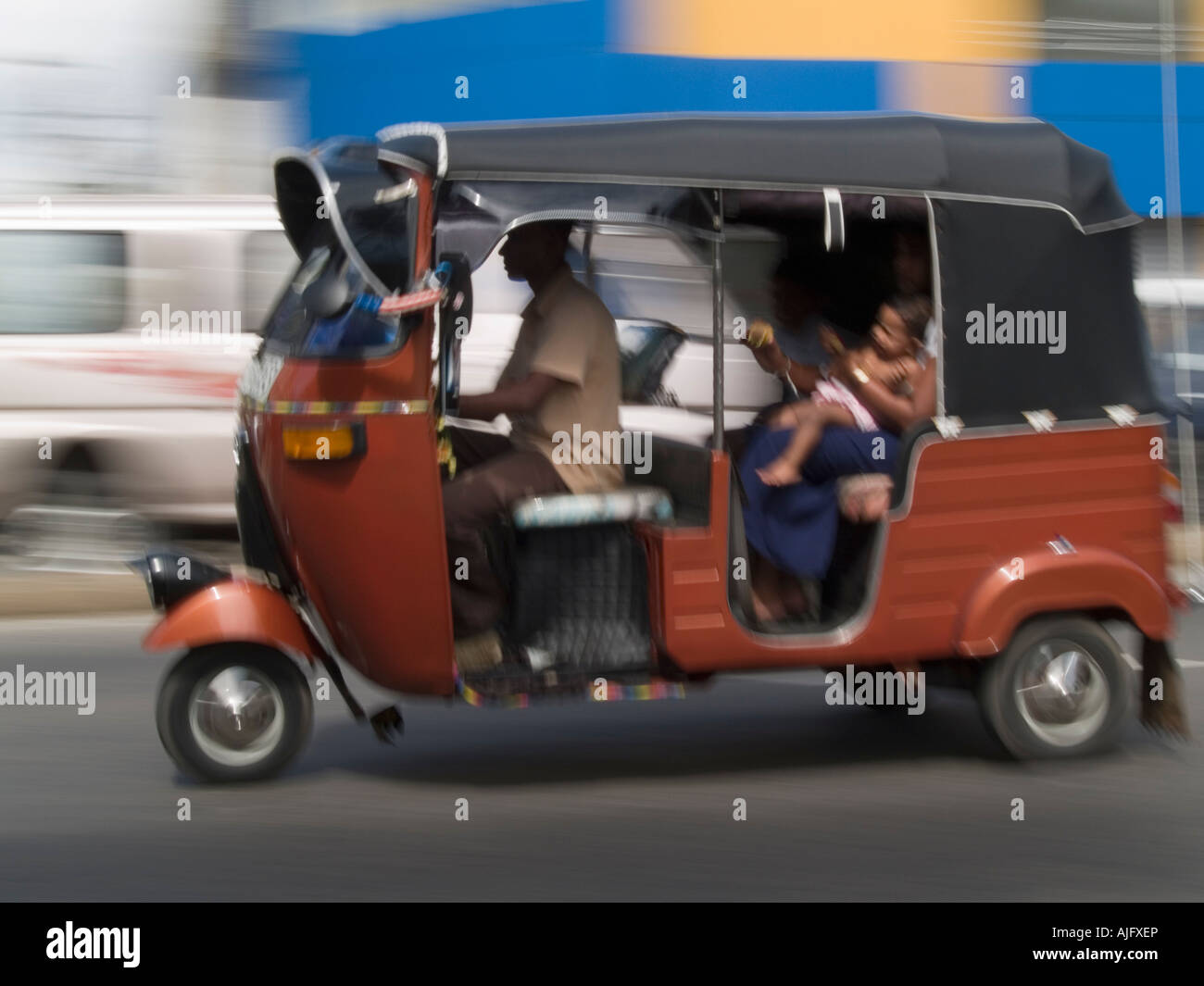 Three wheeled motorized taxi auto-rickshaw Stock Photo - Alamy