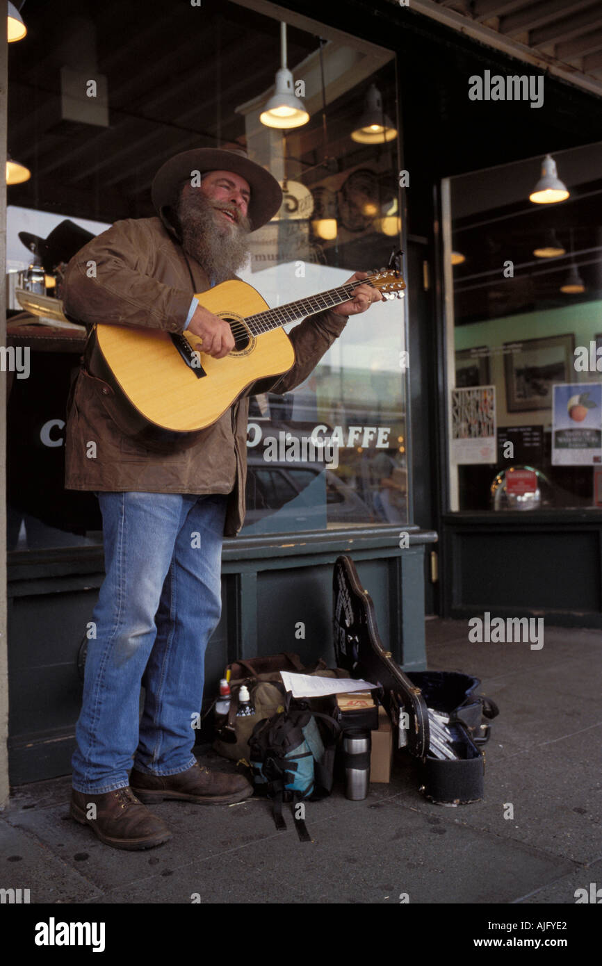 Street Musician With Guitar Performs Outside original Starbucks Coffee ...