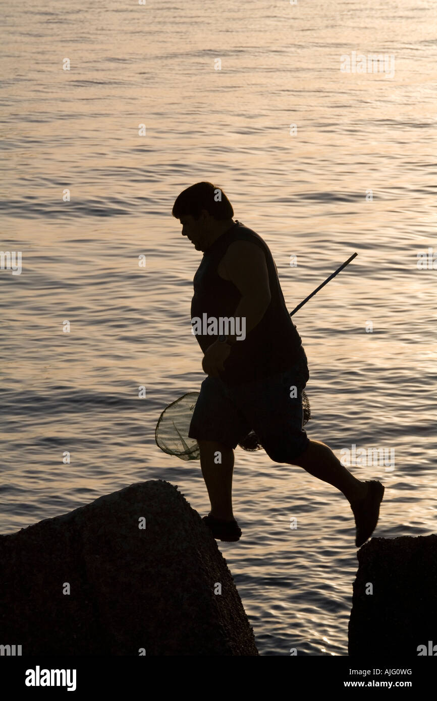 Man walking between stones palermo Sicily Italy Stock Photo - Alamy