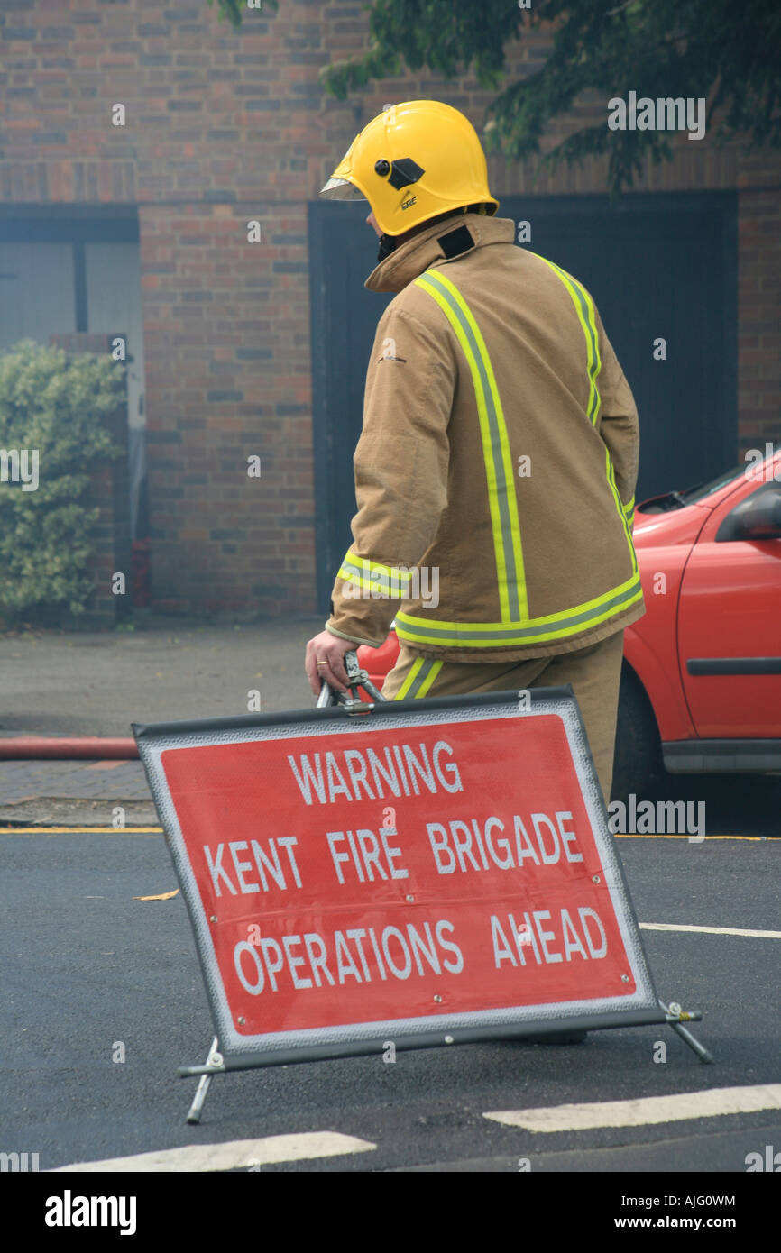 Fireman on guard surveying the aftermath of a housefire in tunbridge ...