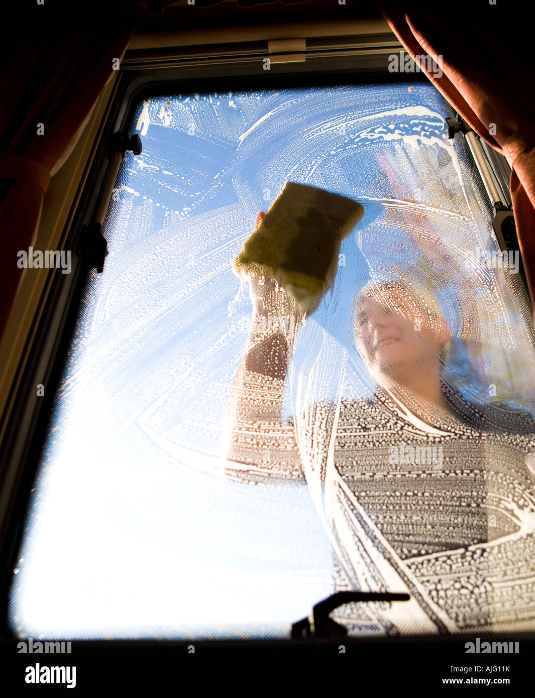 window cleaner seen through window Stock Photo - Alamy